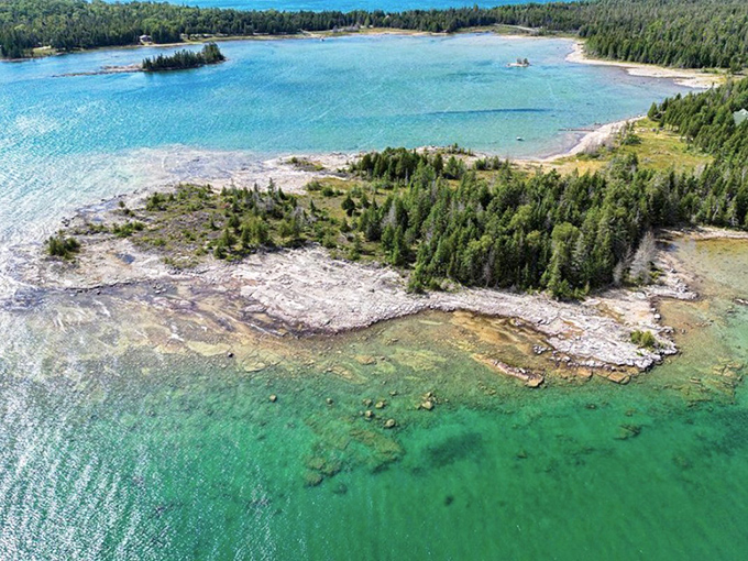 Drummond Island: Turquoise waters meet rugged shoreline in this aerial view, creating a Caribbean-like paradise that's somehow hiding in Michigan's Upper Peninsula.