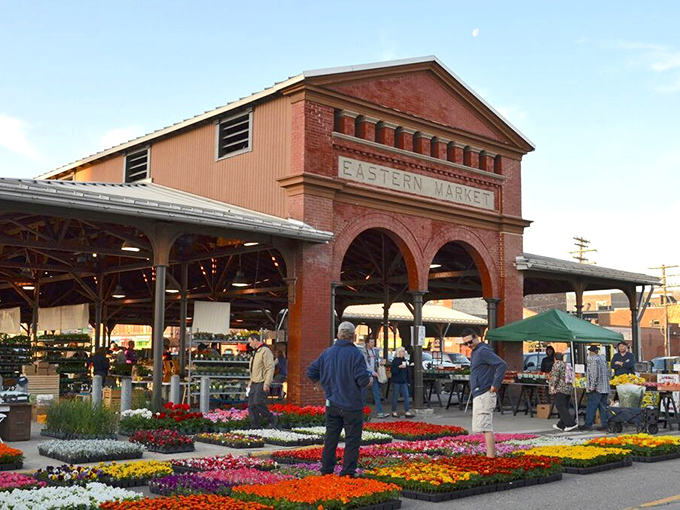 The historic red brick facade of Eastern Market stands as Detroit's culinary cathedral, welcoming food pilgrims with open arches since 1891.