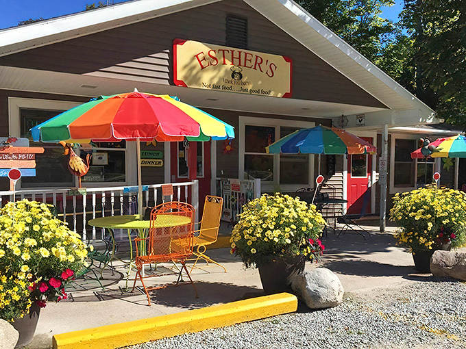 Esther's welcoming exterior bursts with color, rainbow umbrellas standing guard like cheerful sentinels promising delicious adventures within.