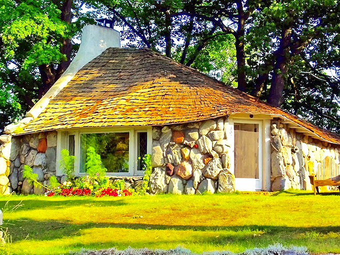 A storybook come to life! This stone cottage with its whimsical thatched roof beckons visitors into a world of enchantment.