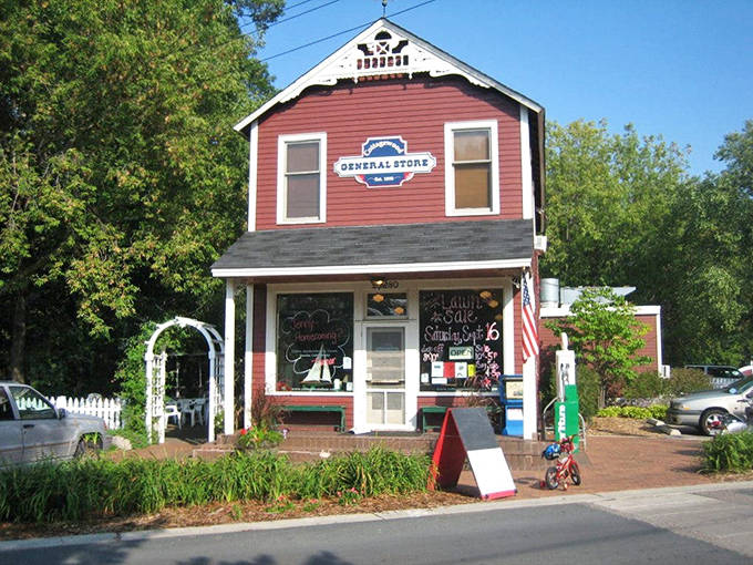 The iconic red clapboard exterior of Cottagewood General Store stands as a charming time capsule in Excelsior, Minnesota.
