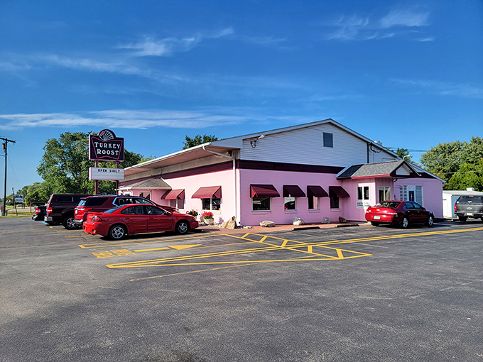 The unmistakable pink exterior of Turkey Roost stands like a rosy beacon of comfort food along the Kawkawlin roadside, promising Thanksgiving vibes year-round.
