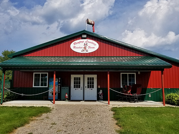 The iconic red barn of Rooftop Landing welcomes visitors with its cheerful charm and promise of magical encounters with Santa's off-duty team.