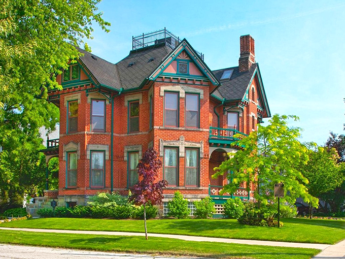 Exterior: Brick and turquoise trim create a Victorian masterpiece that stands proudly on Center Avenue, like the crown jewel of Bay City's historic district.