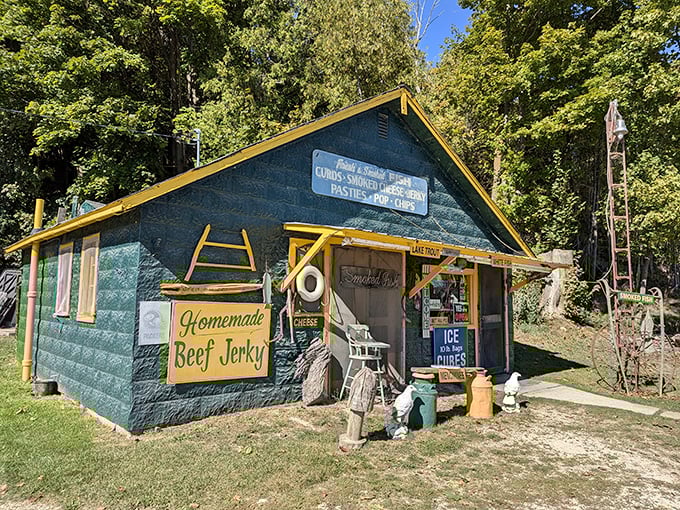 A teal treasure with yellow trim, Manley's stands like a delicious mirage among the trees, promising smoky delights within.