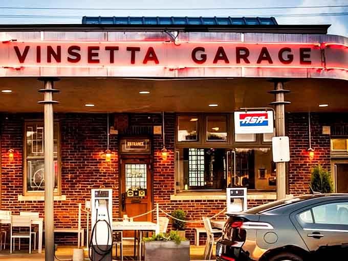 Exterior: The iconic red neon sign of Vinsetta Garage glows against the brick fa&ccedil;ade, beckoning hungry travelers like a delicious lighthouse on Woodward Avenue.