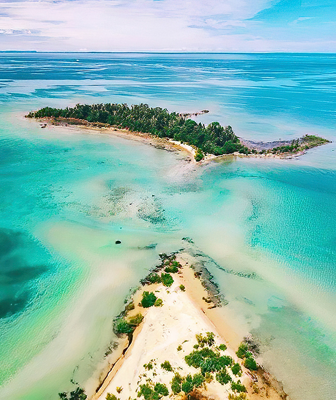 Aerial paradise: Fisherman's Island State Park unfolds like a Caribbean dream, its crescent shores and turquoise waters defying Midwestern expectations.