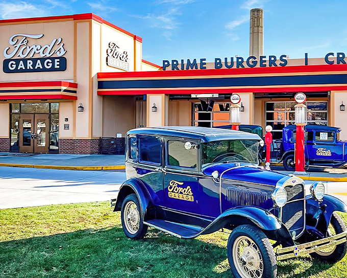 Ford's Garage in Dearborn welcomes hungry travelers with its authentic 1920s facade and vintage Ford vehicle, promising a journey back to automotive glory days.