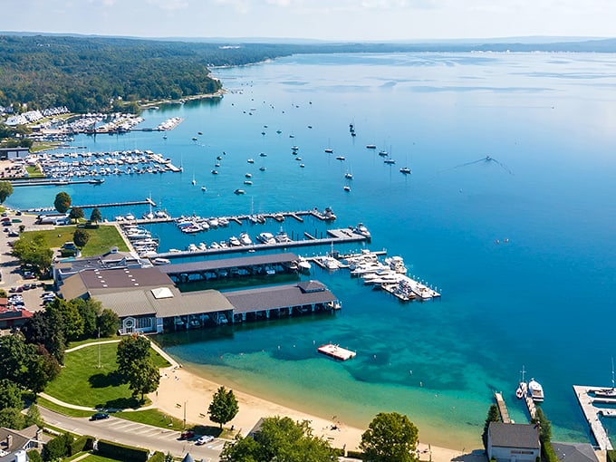 Harbor Springs Marina: Where boats bob like colorful bath toys and the water's so clear you can count fish doing their morning laps around the docks.