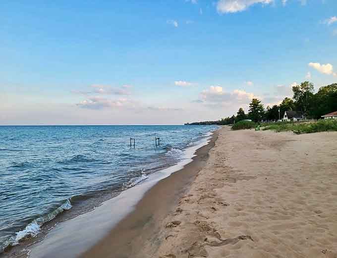 Harrisville State Park welcomes visitors with its iconic stone entrance sign, standing as a gateway to Michigan's coastal paradise.