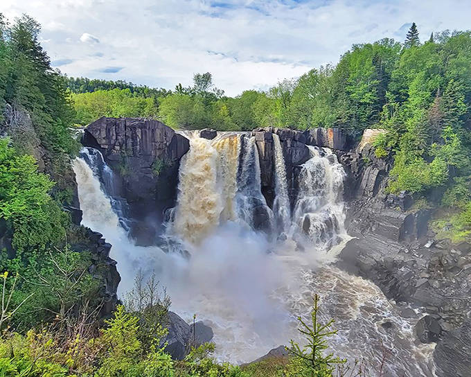 Nature's grand finale: High Falls cascades 120 feet down ancient basalt cliffs, creating a misty spectacle that's worth every step of the journey.