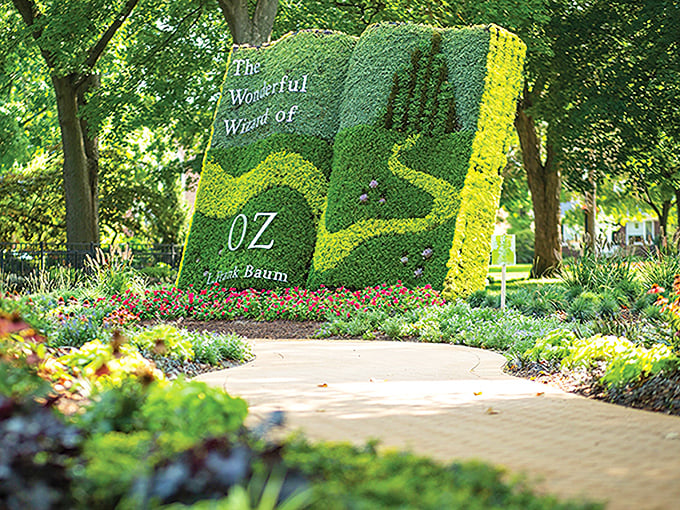 The yellow brick road winds through Centennial Park, its golden pavers gleaming in the sunlight like an invitation to adventure.