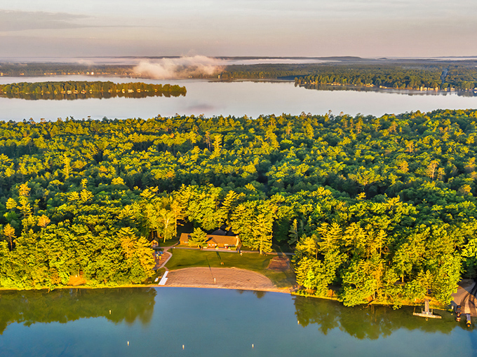 Aerial view of Interlochen State Park, where forest meets water in a perfect Michigan marriage. Nature doesn't get more photogenic than this!