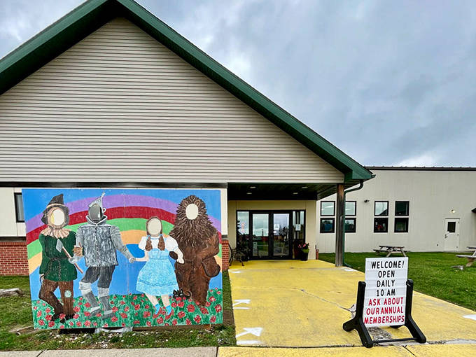 The welcoming facade of the Judy Garland Museum in Grand Rapids, complete with a colorful Wizard of Oz mural that instantly transports visitors to childhood wonder.