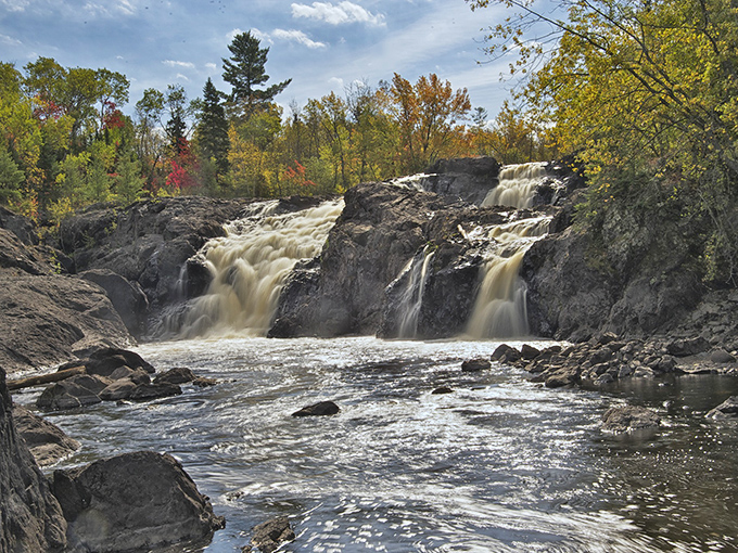 Kawishiwi Falls: Nature's symphony in motion &ndash; where rushing water meets ancient rock in a display that's been perfecting itself for millennia.