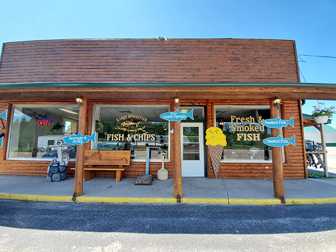 A rustic log cabin treasure beckons with bright blue fish signs &ndash; King's Fish Market isn't just a restaurant, it's a UP institution where smoke meets fish in perfect harmony.