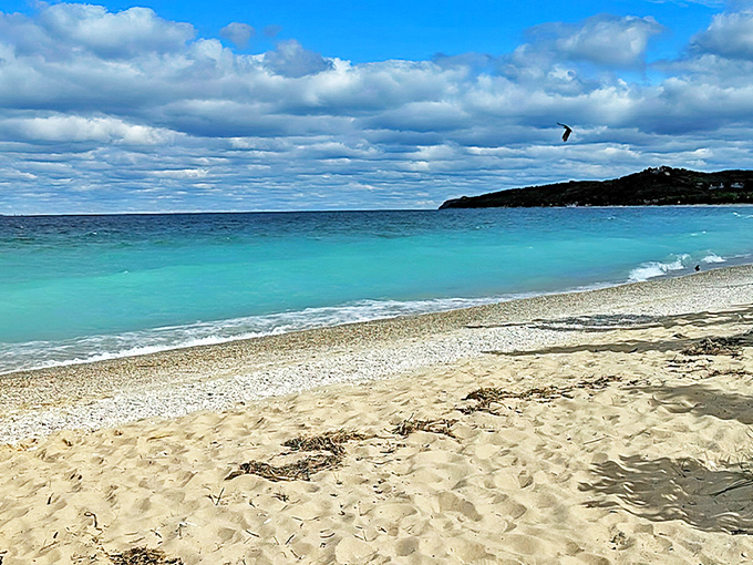Caribbean-blue waters meet golden sands at Lake Street Beach, where Michigan somehow smuggled in a slice of tropical paradise.
