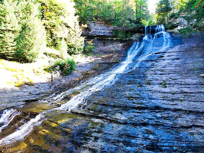 Cascading beauty in motion – Laughing Whitefish Falls tumbles down ancient limestone steps like nature's own staircase to serenity.