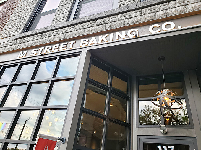 M Street Baking Company's stone facade welcomes sweet-toothed adventurers to downtown Howell, promising sugary treasures behind those gleaming windows.