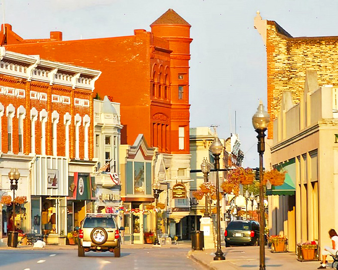 Manistee's vibrant downtown glows with historic charm, its distinctive red brick buildings standing proud against Michigan's blue skies.
