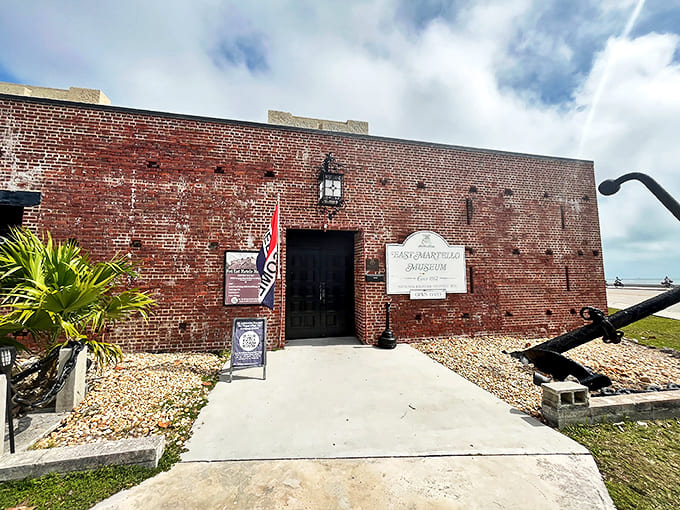 Fort East Martello Museum stands like a brick sentinel against the Florida sky, its weathered walls holding secrets darker than any pirate's treasure.