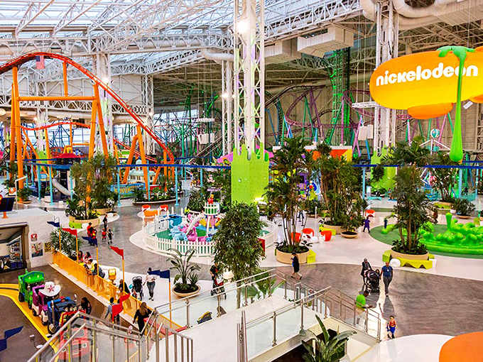 Nickelodeon Universe sprawls across 7 colorful acres inside Mall of America, where roller coasters twist beneath sunlight streaming through glass ceilings.