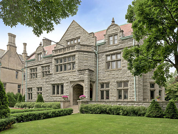 Majestic stone turrets and gables rise against the Minnesota sky, proving European grandeur found its way to the Midwest in this stunning castle-like mansion.