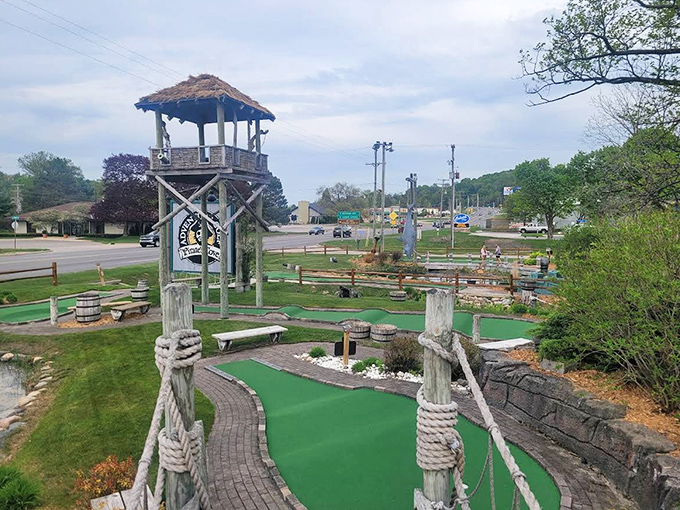 The watchtower stands sentinel over Pirate's Cove Adventure Golf, where putting prowess meets swashbuckling fantasy in Petoskey's most whimsical playground.