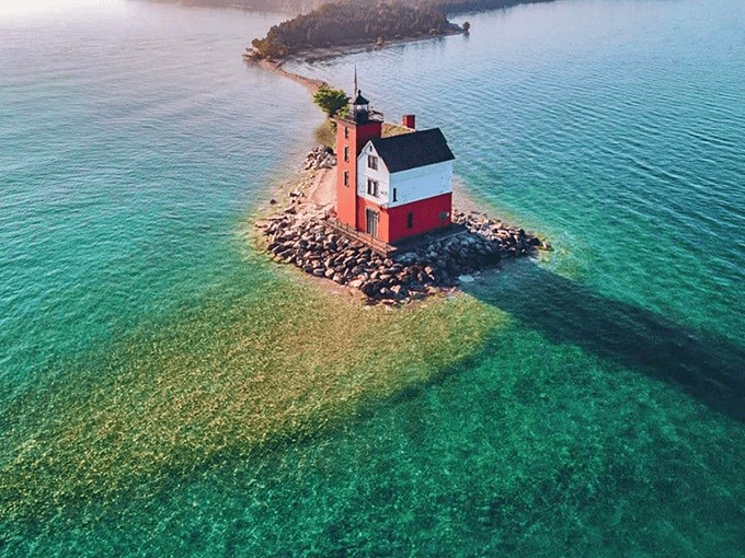 Round Island Light stands majestically in turquoise waters, looking like it's floating on a hidden sandbar &ndash; Michigan's answer to a Caribbean fantasy.