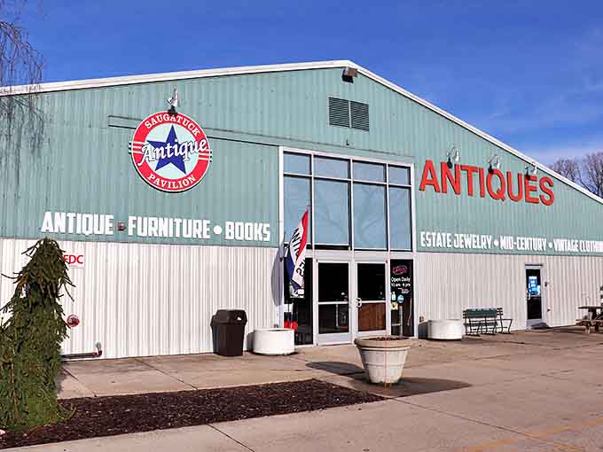 The mint-green exterior of Saugatuck Antique Pavilion stands like a beacon for treasure hunters, its star logo promising adventures in time travel.