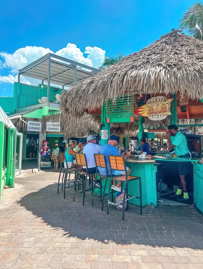 Paradise found: Sharky's tiki bar welcomes you with swaying palms and that unmistakable "your vacation starts now" vibe.