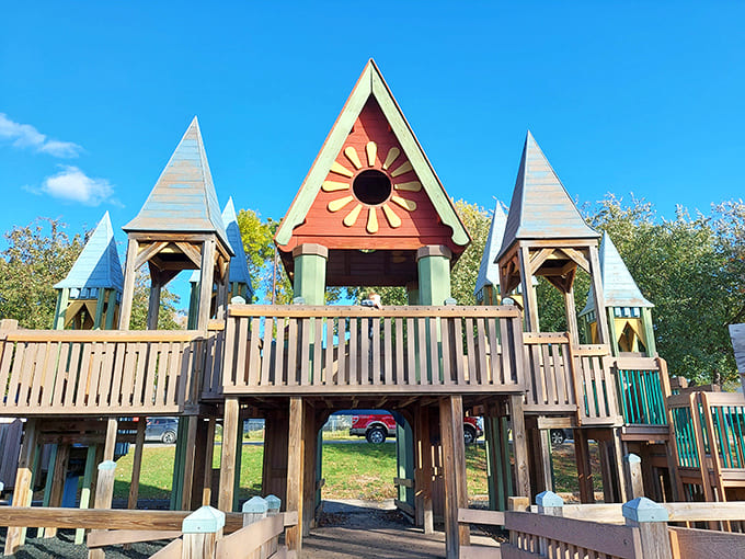 Sherlock Forest Playground's whimsical entrance welcomes visitors with storybook charm, its wooden turrets and sunburst design promising adventures beyond the ordinary.
