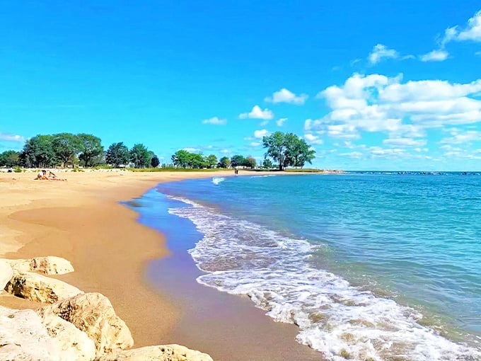 Golden sands meet crystal blue waters at Simmons Island Beach, where Lake Michigan masquerades as the Caribbean on sunny summer days.