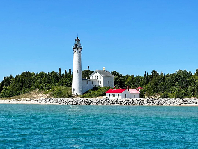 South Manitou Island Lighthouse: A gleaming white sentinel against turquoise waters so vibrant you'll swear someone cranked up the saturation on Mother Nature herself.
