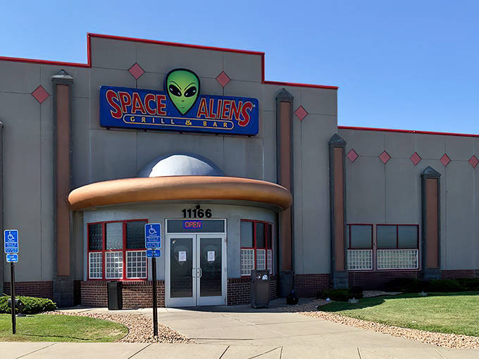 The unmistakable entrance to Space Aliens Grill & Bar beckons earthlings with its UFO design and glowing green guardian &ndash; Minnesota's own Area 51 for foodies.