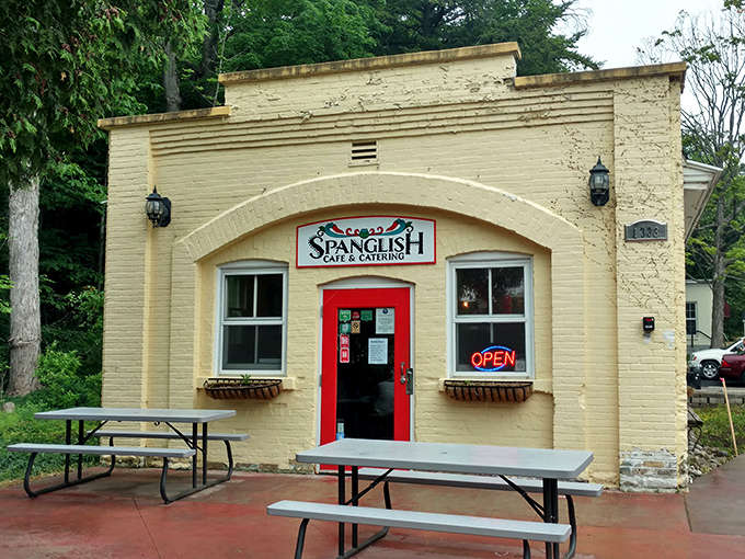 That butter-yellow exterior with the cherry-red door isn't just charming, it's basically a beacon calling you to tamale paradise in Traverse City.