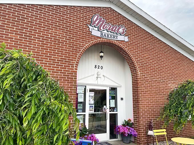 That charming brick exterior with its arched doorway isn't just pretty, it's your gateway to carbohydrate paradise and possibly the best decision you'll make all week.