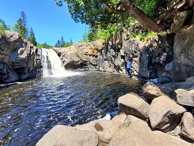 Nature's perfect plunge pool: where Minnesota shows off without even trying, creating a waterfall that belongs on the cover of travel magazines.