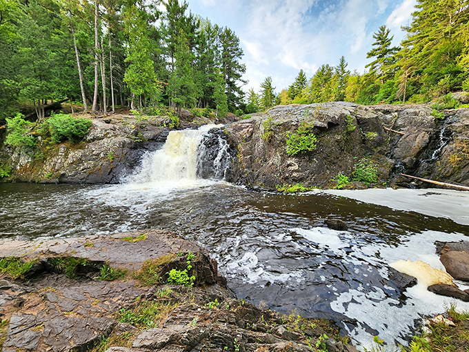 Dead River Falls announces itself with the kind of dramatic flair that makes you grateful you left the couch today.