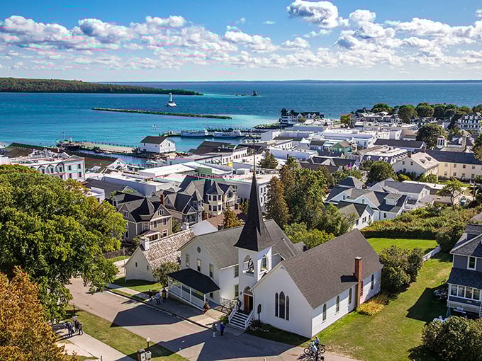 Mackinac Island's picturesque harbor welcomes visitors with Victorian charm and crystalline waters, a postcard-perfect introduction to Michigan's car-free paradise.