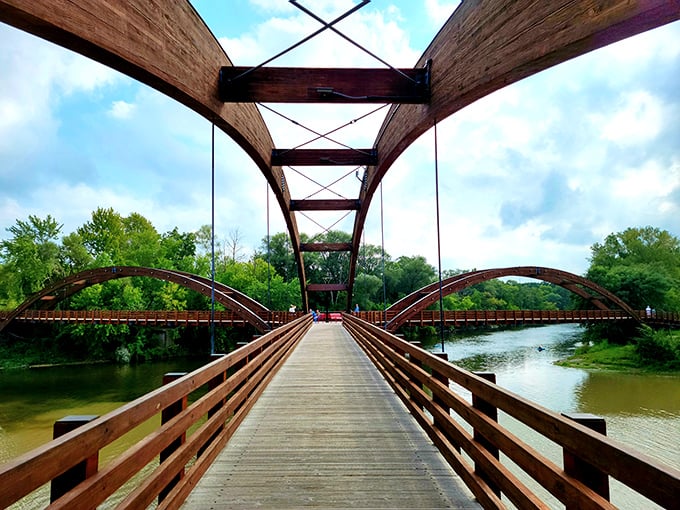 The Tridge stands proudly as the world's only three-way wooden footbridge, its majestic arches spanning the converging rivers like outstretched arms welcoming visitors.