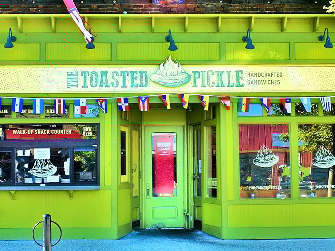 The lime-green facade of The Toasted Pickle stands out like a beacon of sandwich salvation on Grand Haven's Washington Avenue, promising delicious adventures within.
