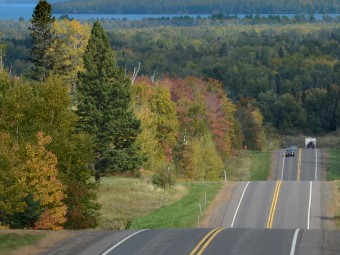 Rolling hills and autumn colors frame this winding stretch of Highway 13, nature's own rollercoaster through Wisconsin's northern wilderness.