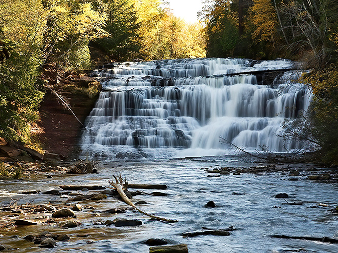 Agate Falls in autumn glory, where Mother Nature shows off her watercolor skills and makes Instagram filters completely unnecessary.