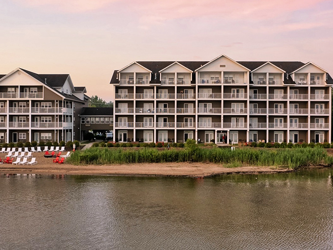 Sunset paints the lakeside fa&ccedil;ade in golden hues, promising waterfront dreams and morning views that redefine "room with a view."