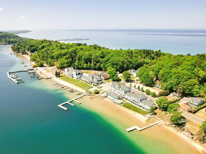 Aerial view of Onekama's stunning shoreline where Portage Lake meets Lake Michigan – nature's perfect two-for-one deal.