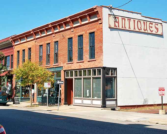 The classic brick façade of Kalamazoo Antiques Market stands as a time portal on Edwards Street, beckoning curious souls with promises of yesteryear.