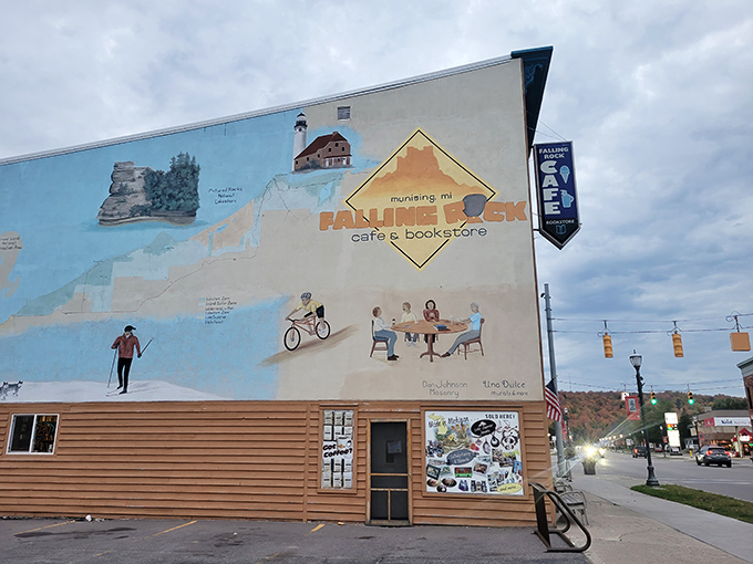 That mural isn't just paint on a wall, it's Munising's personality splashed across the building in living color, complete with lighthouses and cafe dreams.