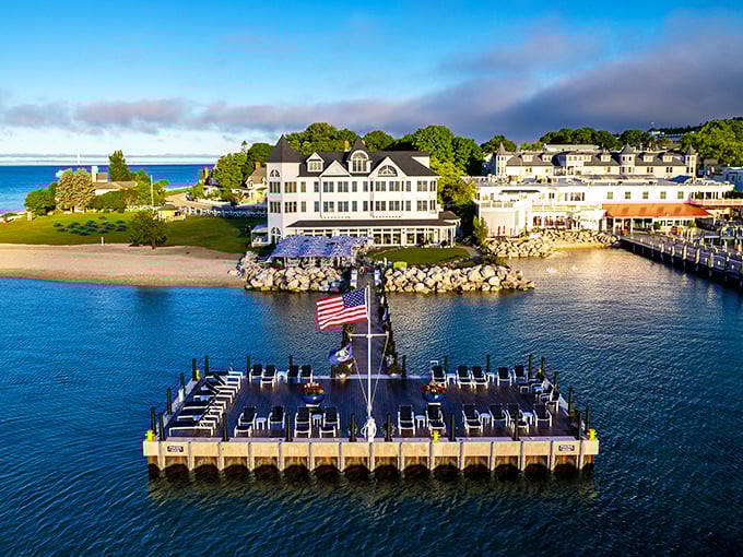 Victorian elegance meets lakeside charm at the Hotel Iroquois, where white clapboard and blue waters create Michigan's most picturesque waterfront retreat.