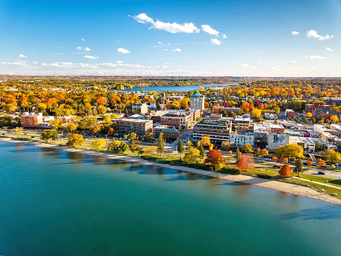 Traverse City's waterfront skyline glows with autumn colors, where Lake Michigan masquerades as the Mediterranean and locals smugly keep the secret.